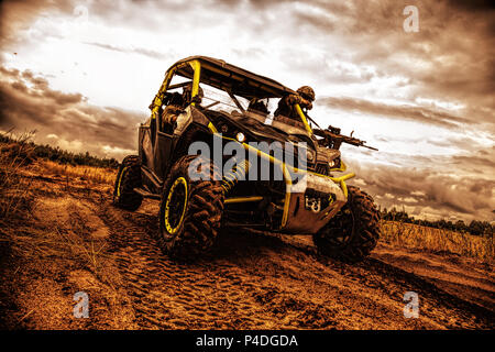 Mobile infantry team goes on military buggy Stock Photo - Alamy