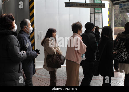 Discipline japanese people are waiting in line to board a public bus in ...