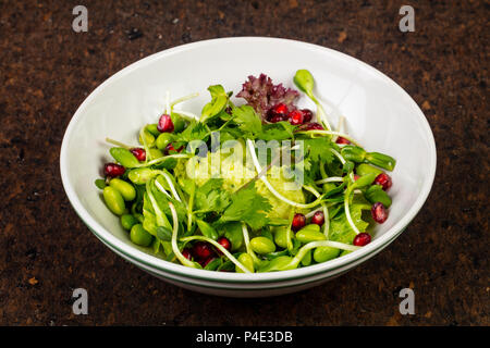 Delicious broad beans with sprouts,pomegranate and avocado pasta Stock ...