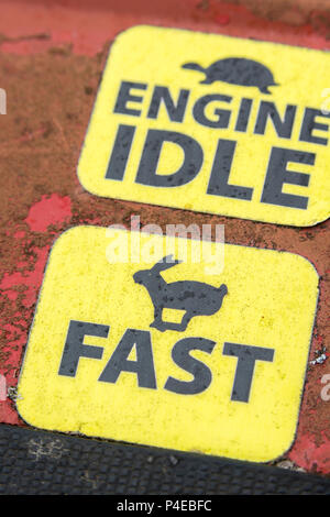 Engine management labels on tractor bodywork. Metaphor for tortoise and ...