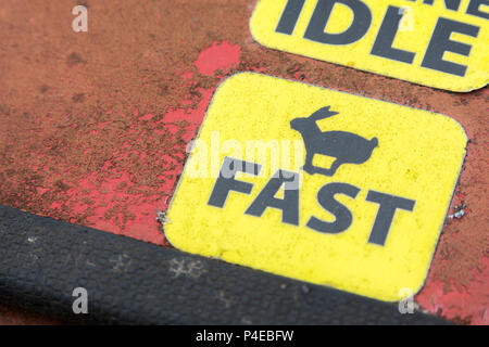 Engine management labels on tractor bodywork. Metaphor for tortoise and ...