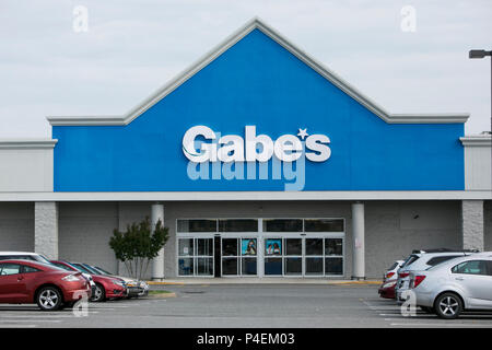 A logo sign outside of a Gabe's retail store location in Martinsburg ...