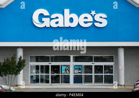 A logo sign outside of a Gabe's retail store location in Martinsburg ...