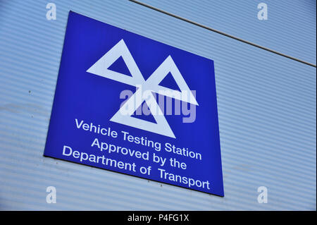 Blue Vehicle Testing Station sign on the outside wall of a service ...