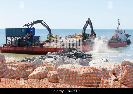 Granite rock groynes protect the beach at Felixstowe Suffolk from ...
