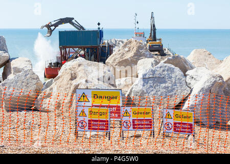 Granite rock groynes protect the beach at Felixstowe Suffolk from ...