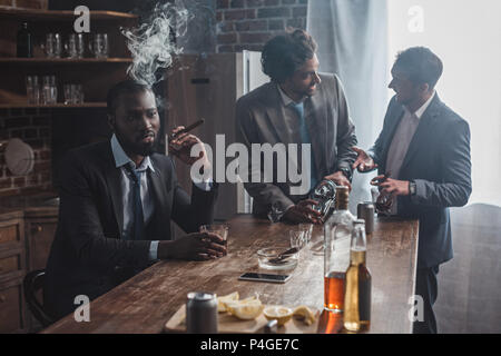 Three men smoking cigars Stock Photo: 19115061 - Alamy