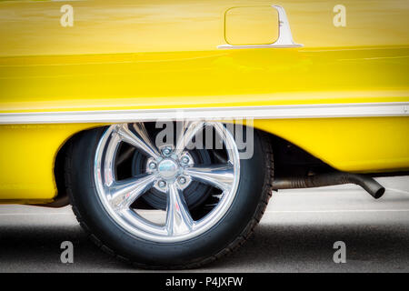 A classic American car, with updated hubcaps, from the sixties in baby ...
