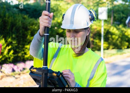 Female civil engineering surveyor using compact digital camera Stock ...