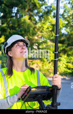 woman surveyor, civil engineer using a theodolite Stock Photo - Alamy