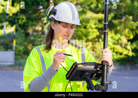 woman surveyor, civil engineer using a theodolite Stock Photo - Alamy