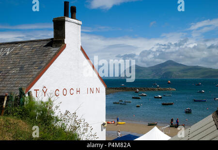 Ty Coch Inn red pub on a beach at Porth Dinllaen village in bay on ...
