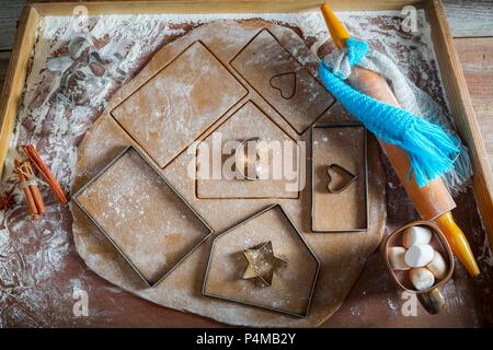 Parts for a gingerbread house being cut out Stock Photo - Alamy