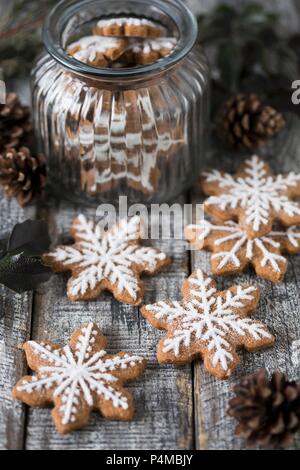 One small gingerbread cookie in the form of a Christmas tree on ...