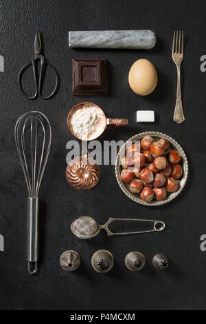 Baking ingredients on dark kitchen table Stock Photo - Alamy