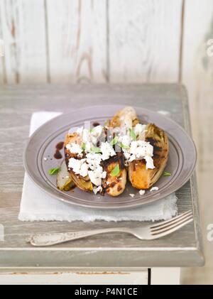 A dish of grilled chicory Stock Photo - Alamy
