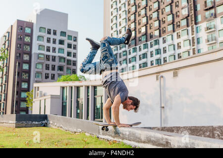 Skateboarder handstand on ramp on the sunset Stock Photo - Alamy