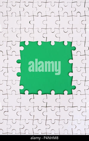 Framing in the form of a rectangle, made of a white jigsaw puzzle ...