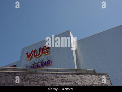 Modern buildings with aluminium cladding, vue cinema, trees pavement ...