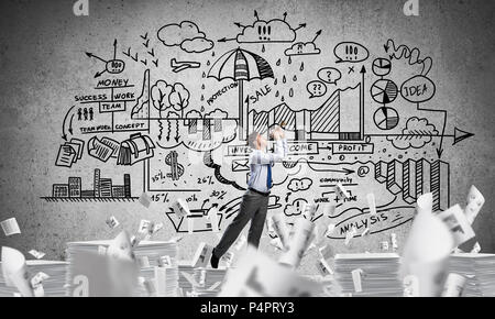 Happy businessman playing fife Stock Photo - Alamy