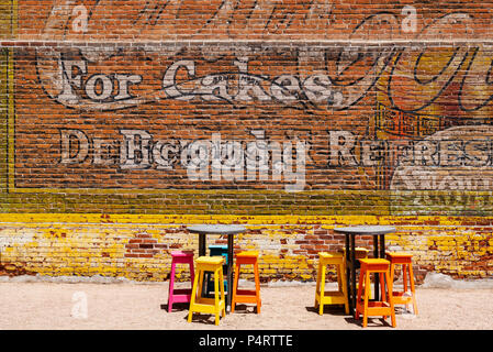 Colorful seats & mural on the side of the Boathouse Cantina restaurant ...
