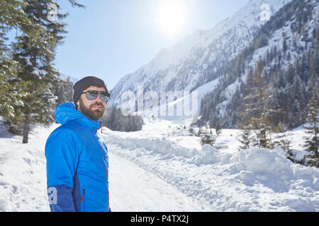 Portrait of a man with sunglasses on a snowy mountain Stock Photo - Alamy