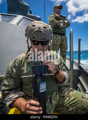 US Navy A Sailor aboard the coastal patrol ship USS Monsoon (PC 4 ...
