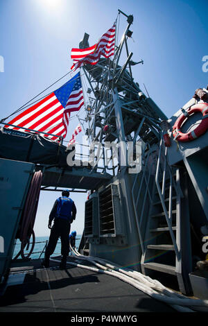 The U.S. Navy Cyclone-class coastal patrol ship USS Squall steams ...