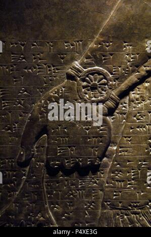 Assyrian winged genie. Assyrian relief from the Northwest Palace of ...