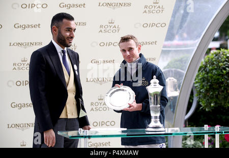 Jockey Ryan Moore (right) during a trophy presentation following ...