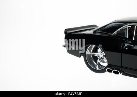 Rear view of a white modified Land Rover Discovery Series I racing on a ...