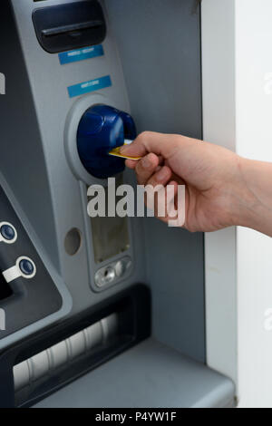 Put it on my card. an unrecognizable man handing over his credit card ...