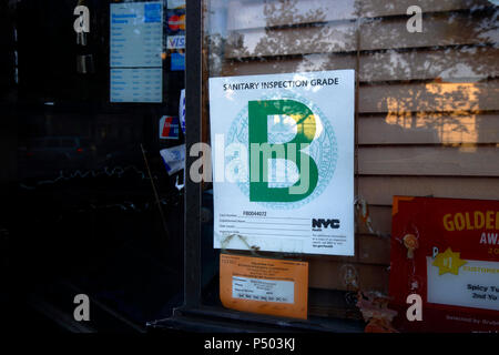 A NYC sanitary inspection "C" letter grade sticker at a food ...