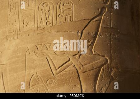 Detail of a relief depicting the Pharaoh making offerings to the ...