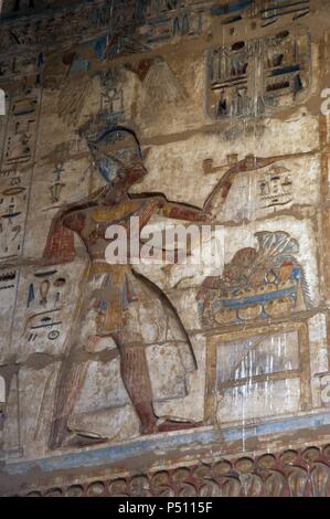 Temple of Ramses III. The pharaoh making offerings before goddess ...