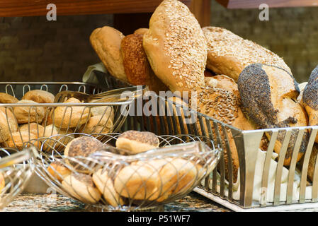 Many different loaves of bread, different varieties and shapes isolated ...