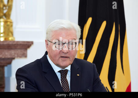 German President Frank-Walter Steinmeier, left, stands during wreath ...