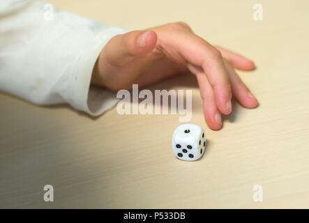 Children playing with a dice Stock Photo - Alamy