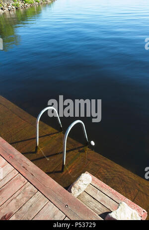 handrails and ladders on wooden jetty Stock Photo - Alamy