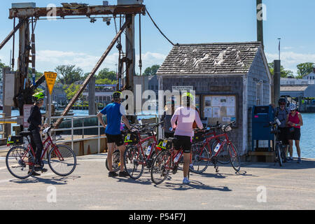 Cyclists wait on Chappaquiddick Island to take the Chappy Ferry across ...