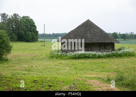 City Rauna, Latvia. Old bathhouse and green meadow, trees. Travel photo ...