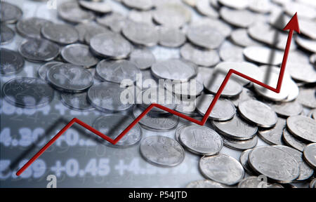 stacks of coins with diagram close up Stock Photo - Alamy