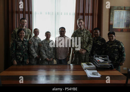 U.S. and Philippine air forces pose for a photo in front of a PAF FA-50 aircraft during a ...
