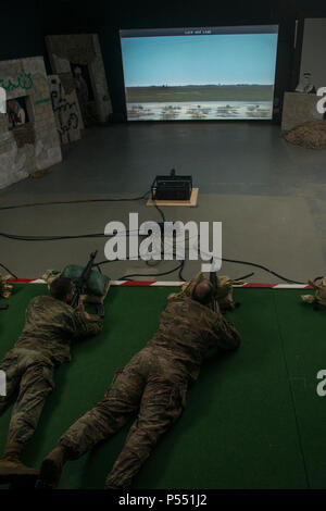 U.S. Soldiers train using the Engagement Skills Trainer II, EST II, at ...