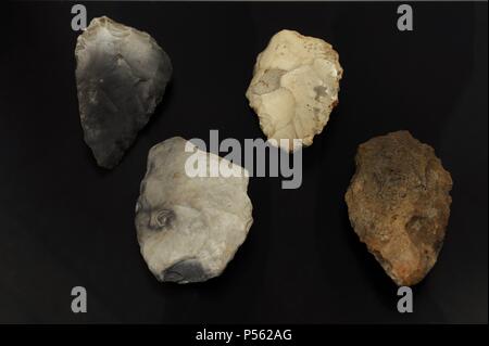 Stone Age hand-axes from Hoxne, Suffolk, England. Engraving from an ...