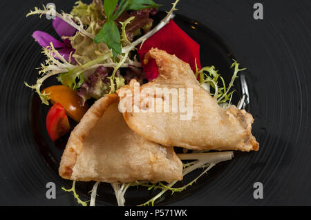 Crispy shark fin in black plate Stock Photo - Alamy