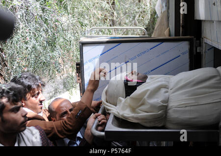 Relatives of nine victims killed in a bank robbery mourn outside the ...