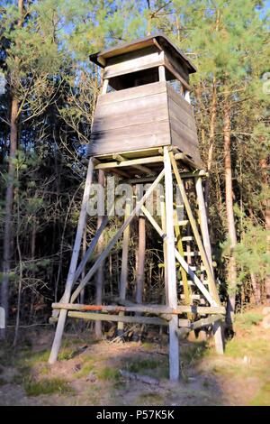 Hunting observation post in the forest in autumn Stock Photo - Alamy