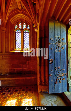 Tynemouth Priory and Castle chapel door and painted window Stock Photo ...