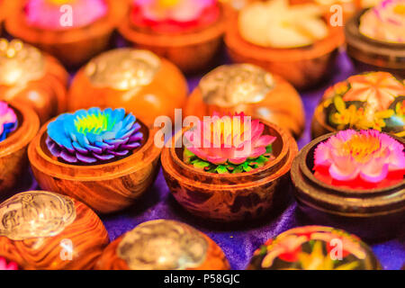 Beautiful colorful bright candle made in the form of an appetizing cake ...